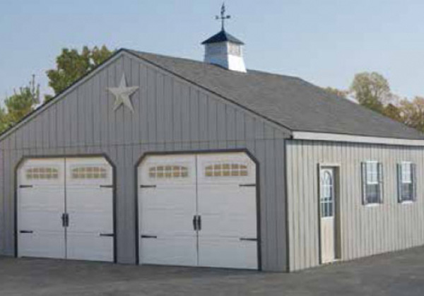 a grey double stall garage with a door and windows on the side